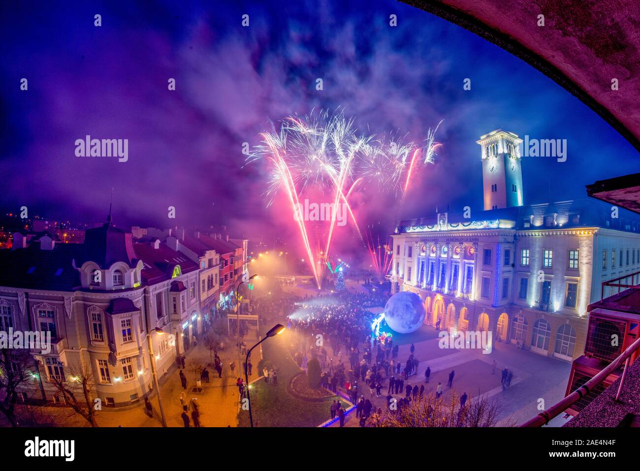 Magnificent fireworks during a street celebration on a square in a town ...