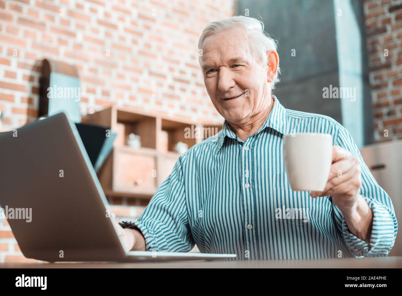 Cheerful senior old man laptop hi-res stock photography and images - Alamy