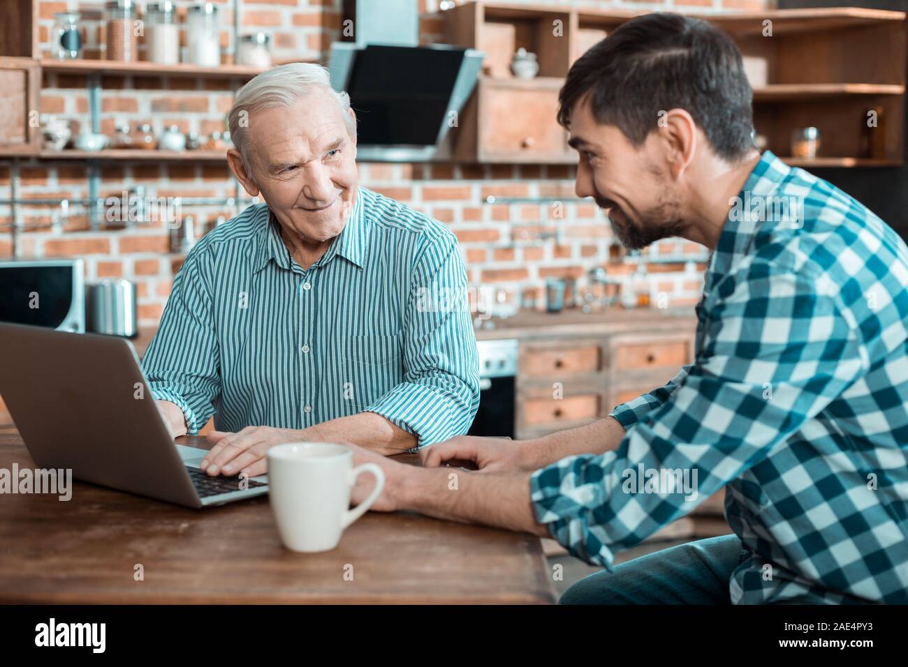 Elderly man talking young hi-res stock photography and images - Alamy