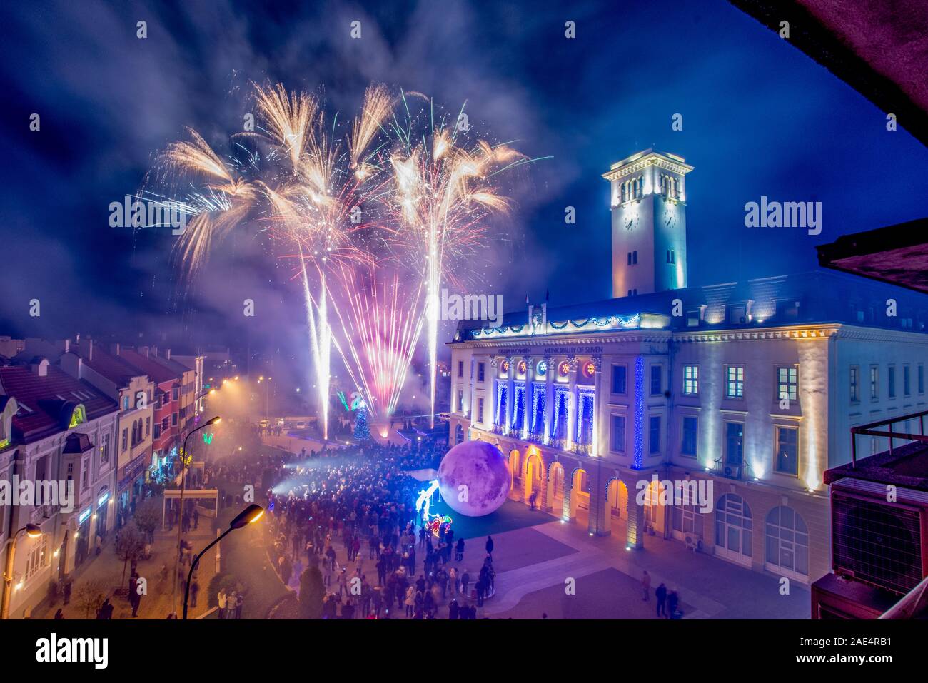 Magnificent fireworks during a street celebration on a square in a town ...
