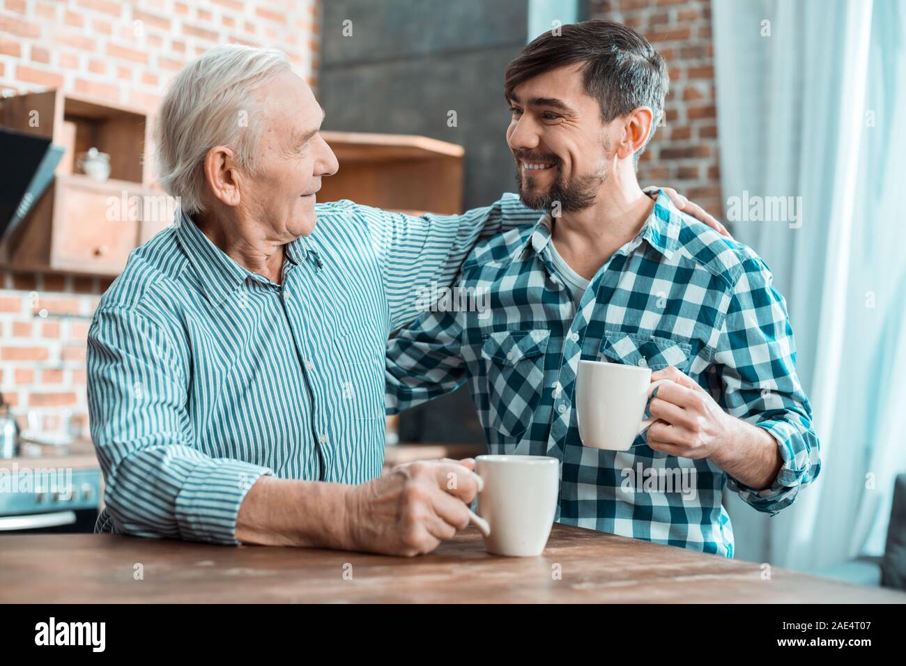 Positive happy father and son spending time together Stock Photo - Alamy
