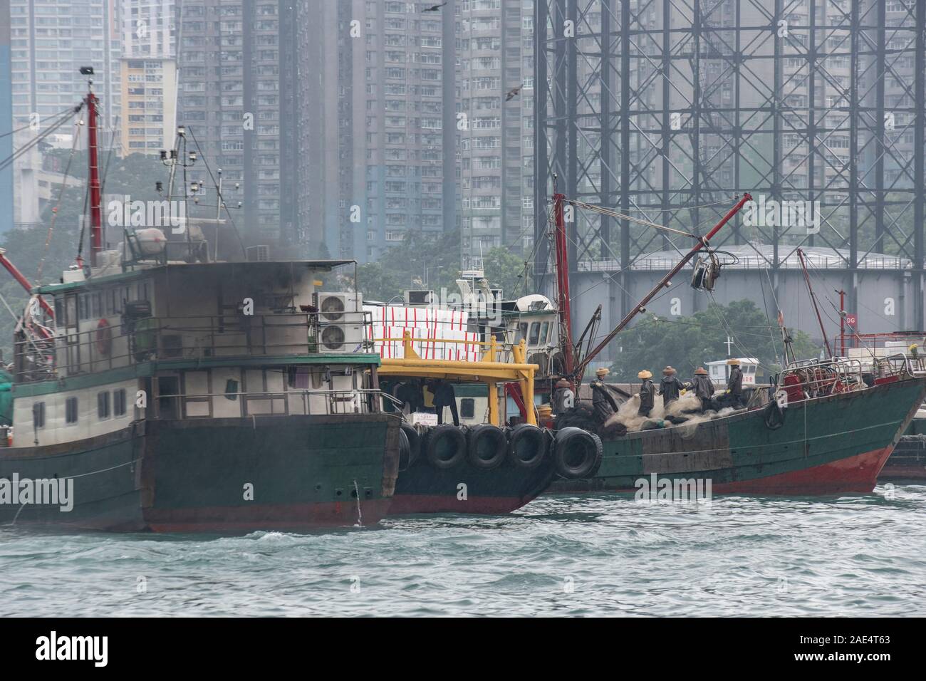 Heavy, black smoke and exhaust spews from Industrial fishing boats and ...