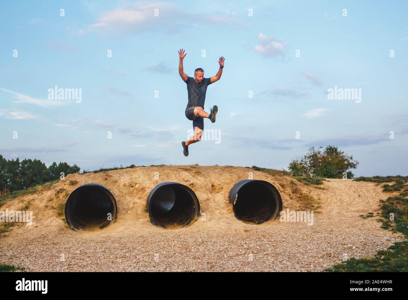 Leaps with outstretched arms hi-res stock photography and images - Alamy