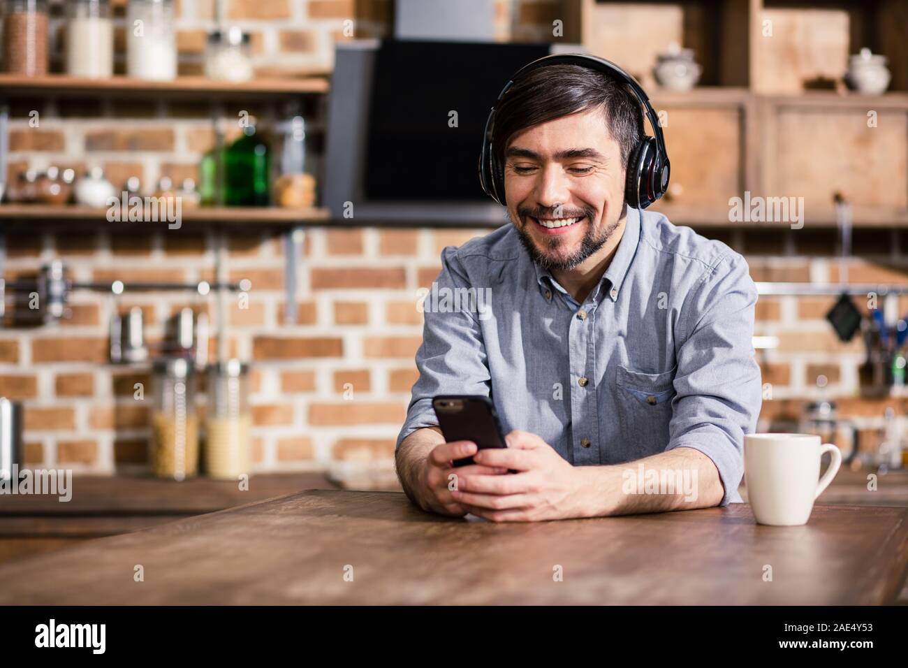 Smiling while listening to music hi-res stock photography and images ...