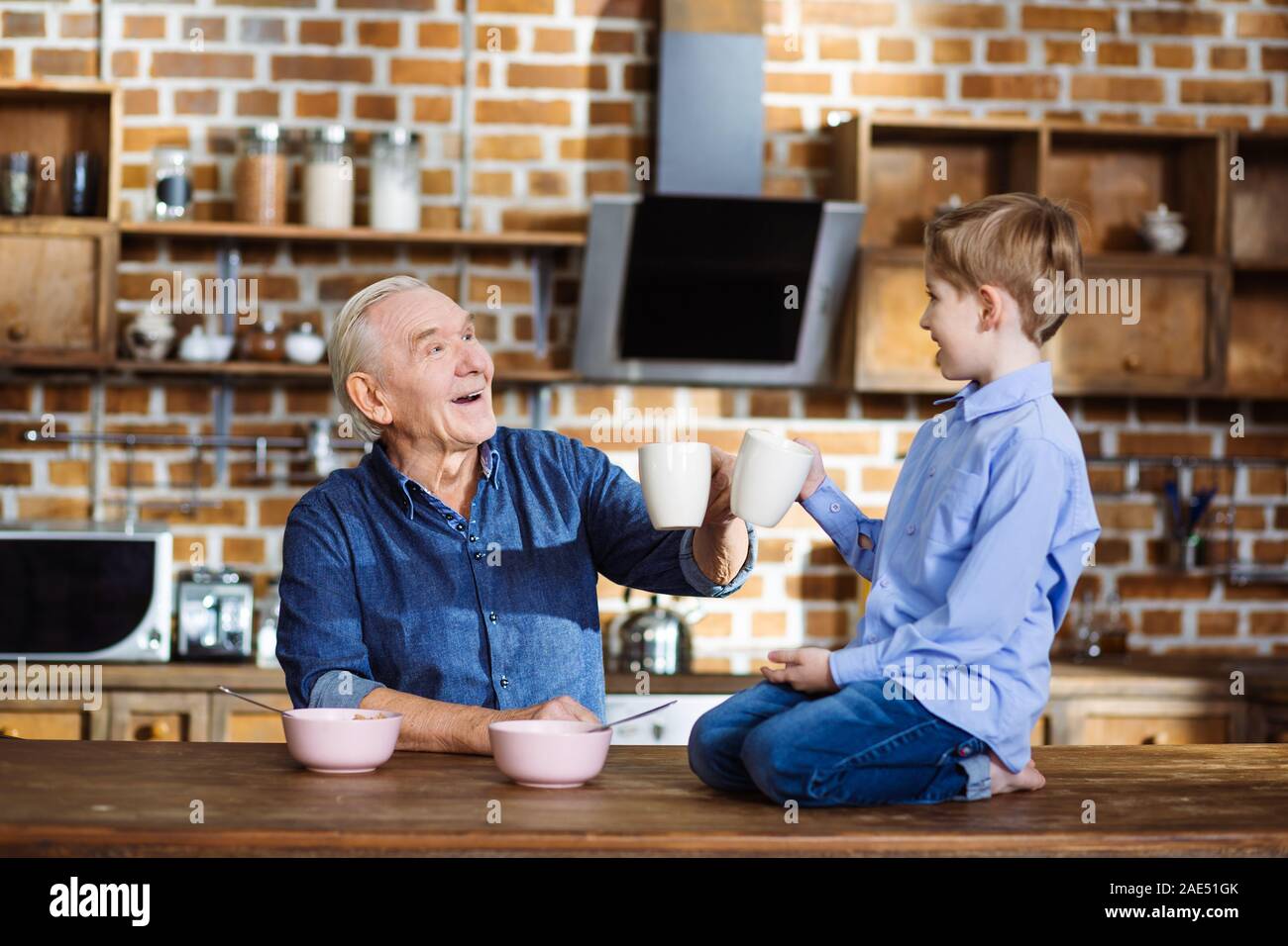 Little boy drinking tea hi-res stock photography and images - Alamy