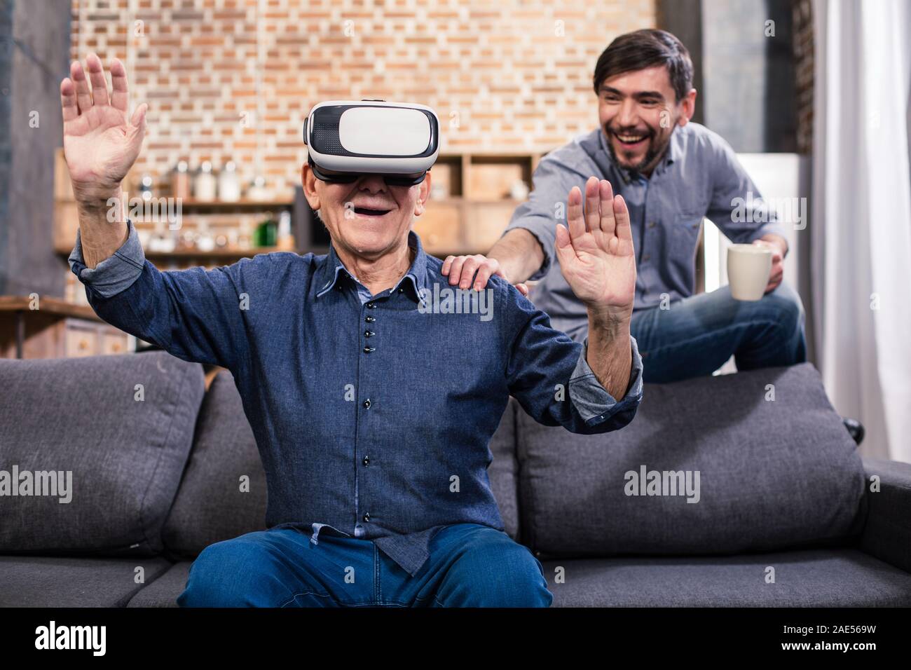 Elderly man using device hi-res stock photography and images - Alamy