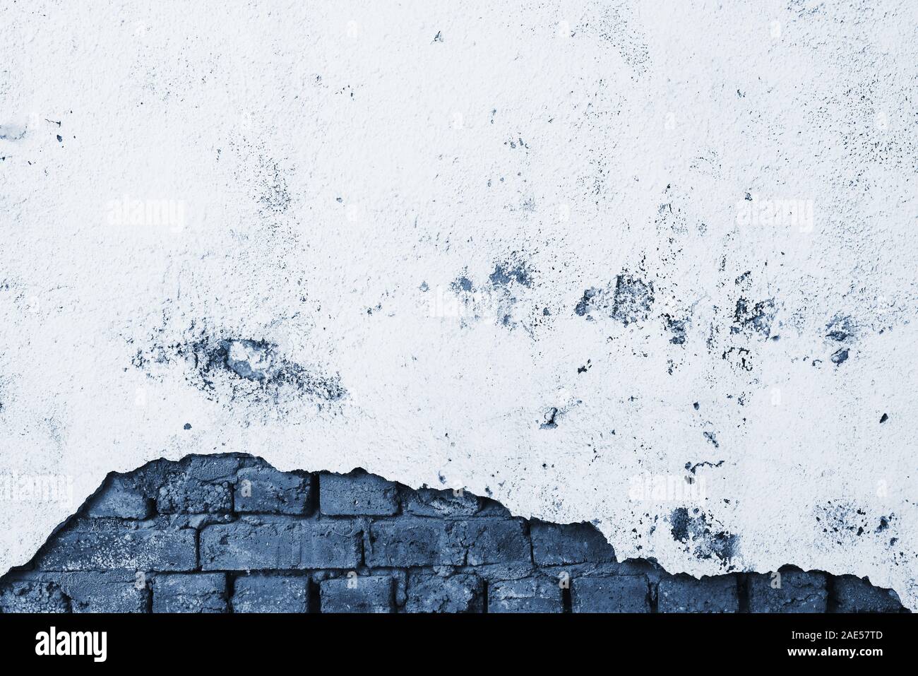 Broken battered wall with stucco and bricks in classic blue. Beautiful ...
