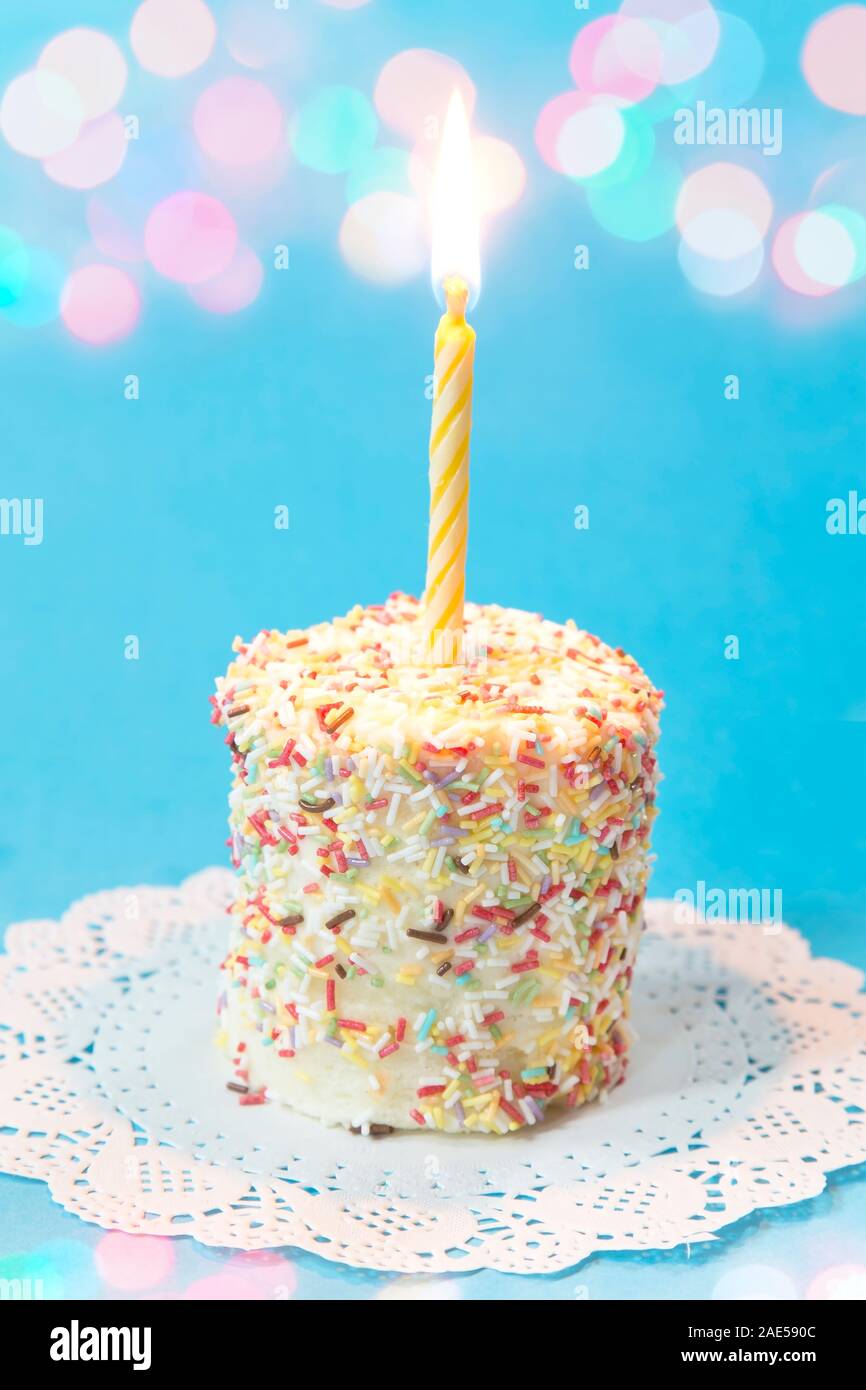 Birthday cake with a burning candle Stock Photo - Alamy Birthday cake with a burning candle Stock Photo - Alamy