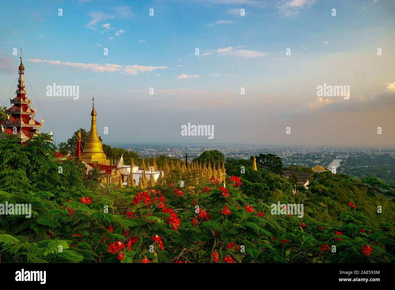 View over the city of Mandalay at sunset from Mandalay Hill, with red ...