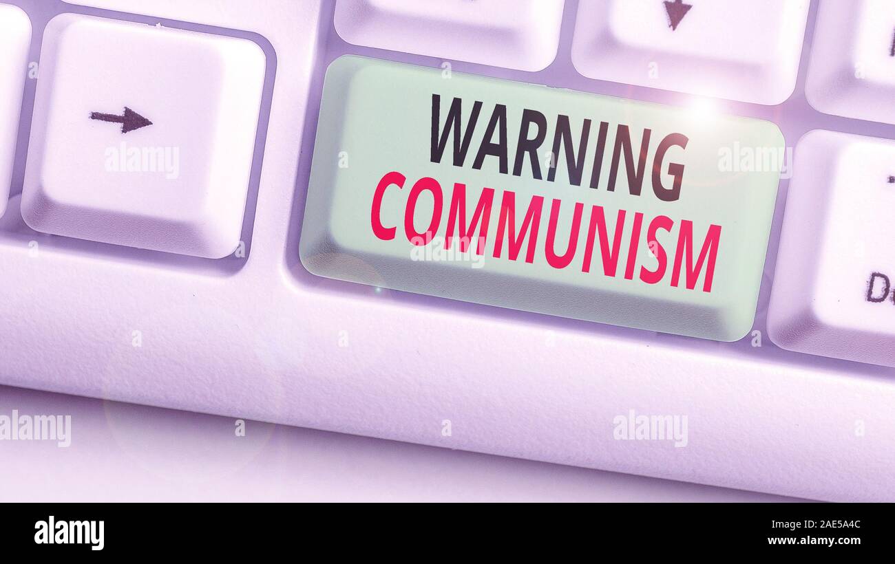 Writing note showing Warning Communism. Business concept for economic ...