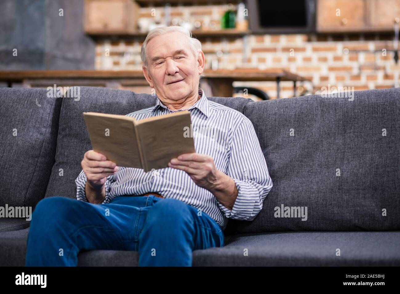 Relaxed senior man reading hi-res stock photography and images - Alamy