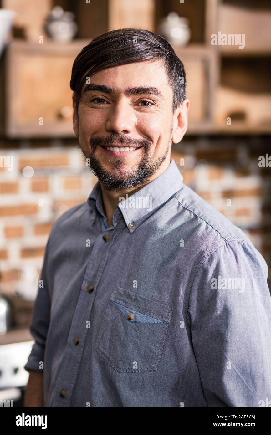 Smiling young man cheering hi-res stock photography and images - Alamy