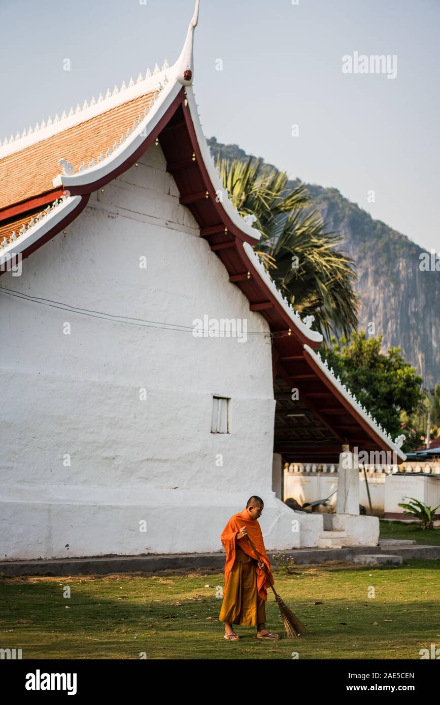 Monk cleaning street in the Luang Prabang, Laos, Asia Stock Photo - Alamy