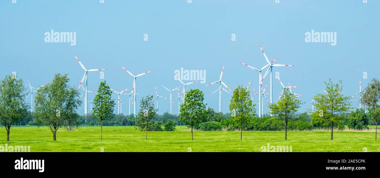 Wind turbines generating electricity in a wind farm in Saxony-Anhalt ...