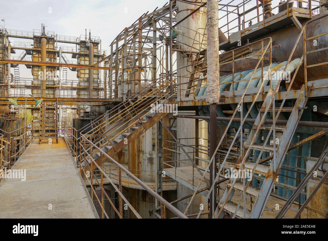Old Factory metal structures. Industrial plant with old rusty pipes and ...