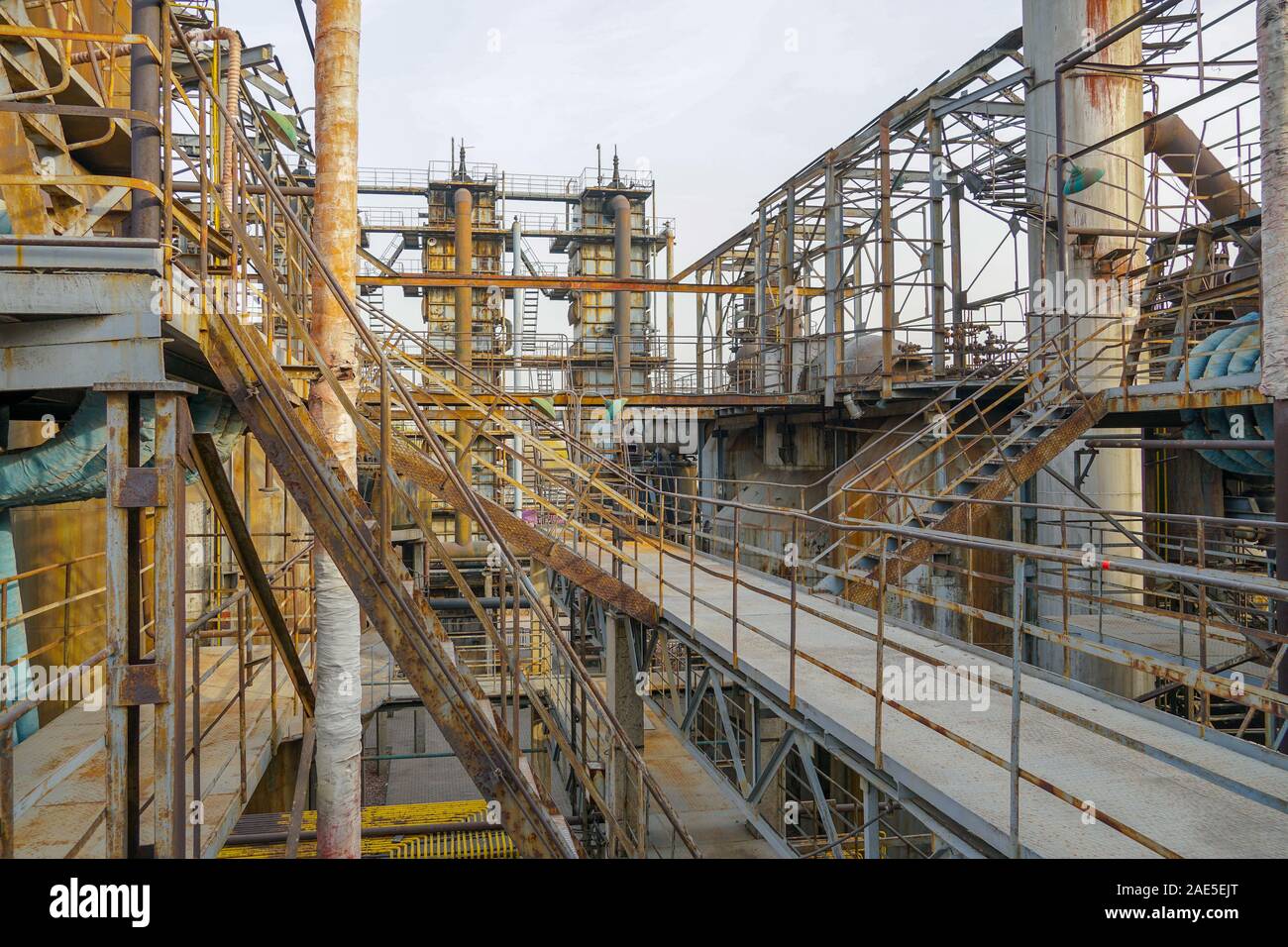 Old Factory metal structures. Industrial plant with old rusty pipes and ...