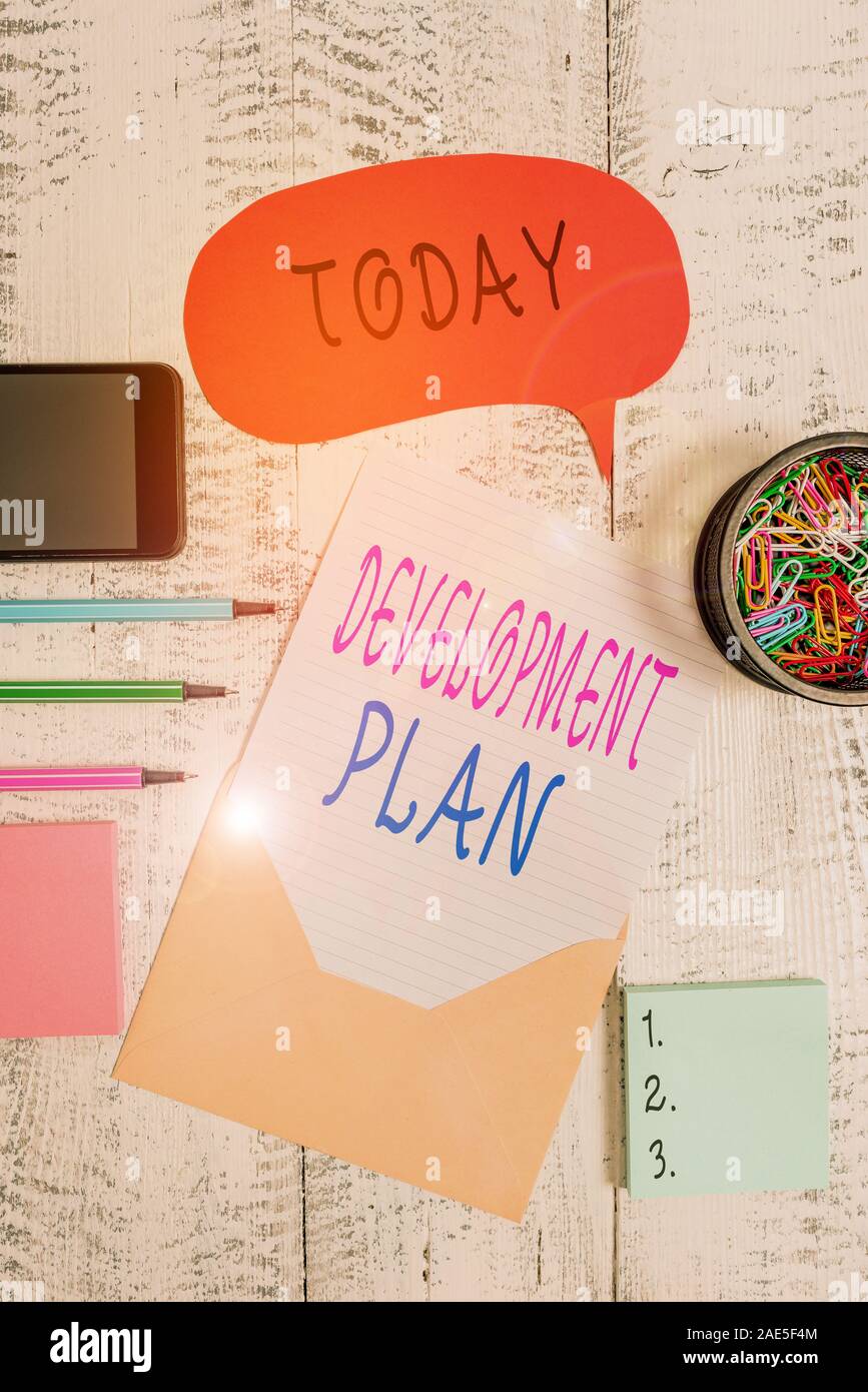 Handwriting text Development Plan. Conceptual photo the planning of the ...