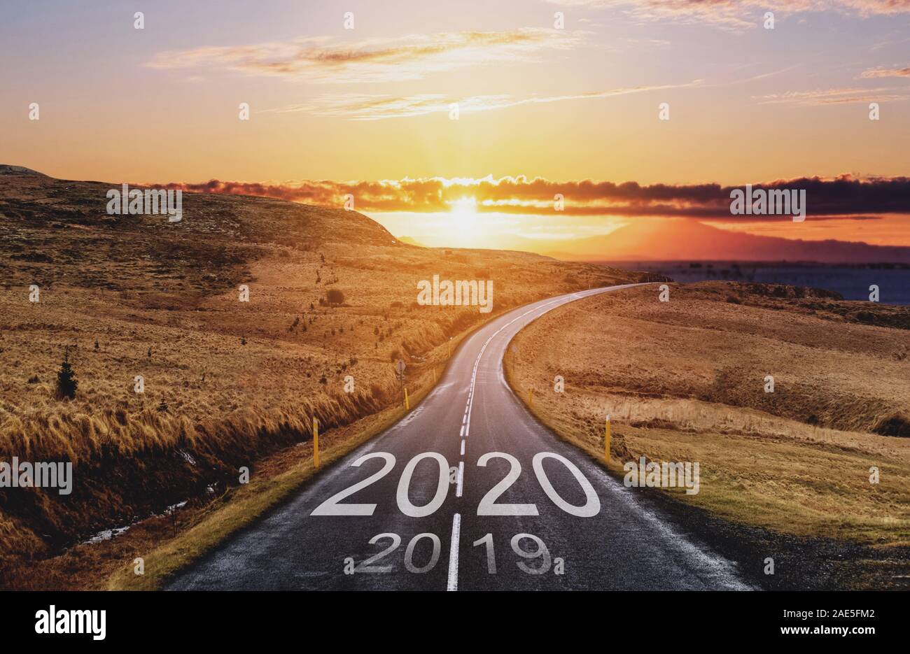 2020 and 2019 on the empty road at sunset. New Year concepts Stock ...
