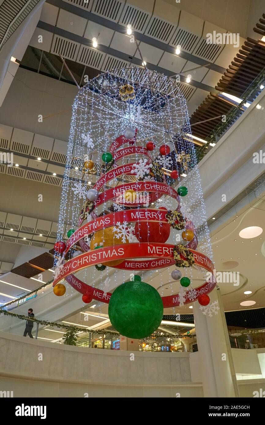 Multilevel shopping mall interior decorated with Christmas decoration ...