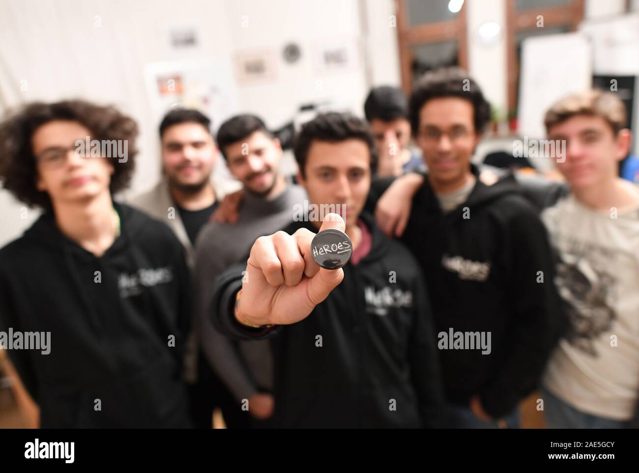 Munich, Germany. 28th Nov, 2019. A member of the "HEROES München" holds ...