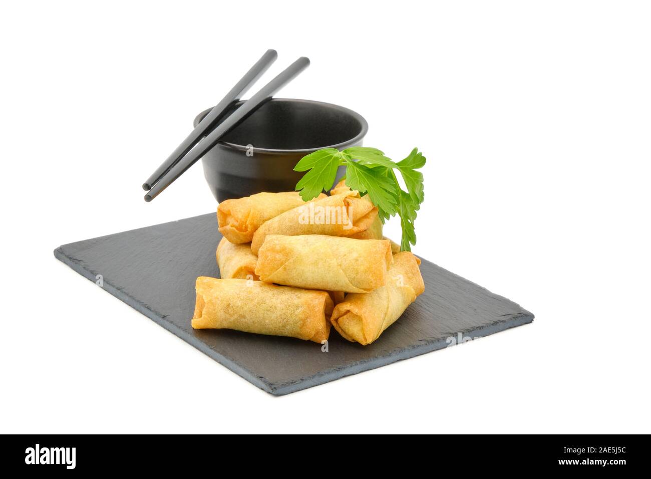Plate of vegetarian Thai spring rolls served with a spicy dipping sauce ...