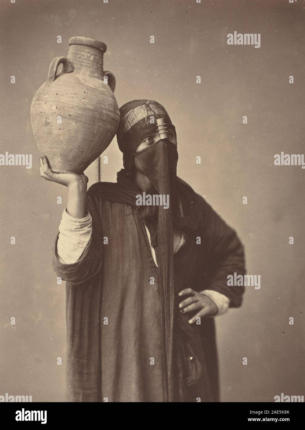 A photograph by Félix Bonfils circa 1870 depicting a water carrier in ...