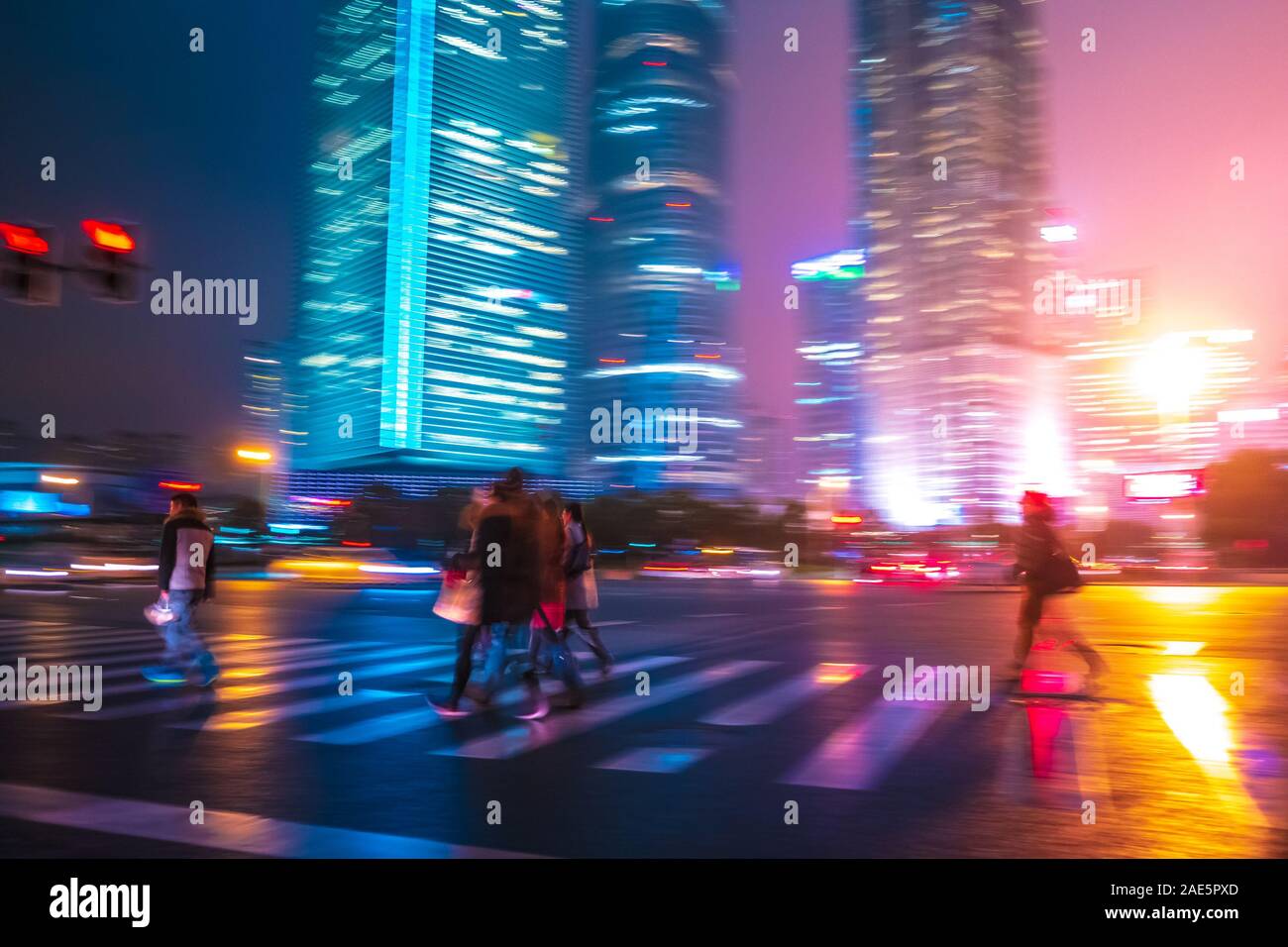 Abstract background of People across the crosswalk at night in Shanghai ...