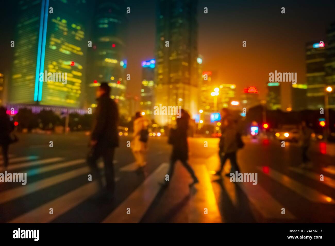 Abstract background of People across the crosswalk at night in Shanghai ...