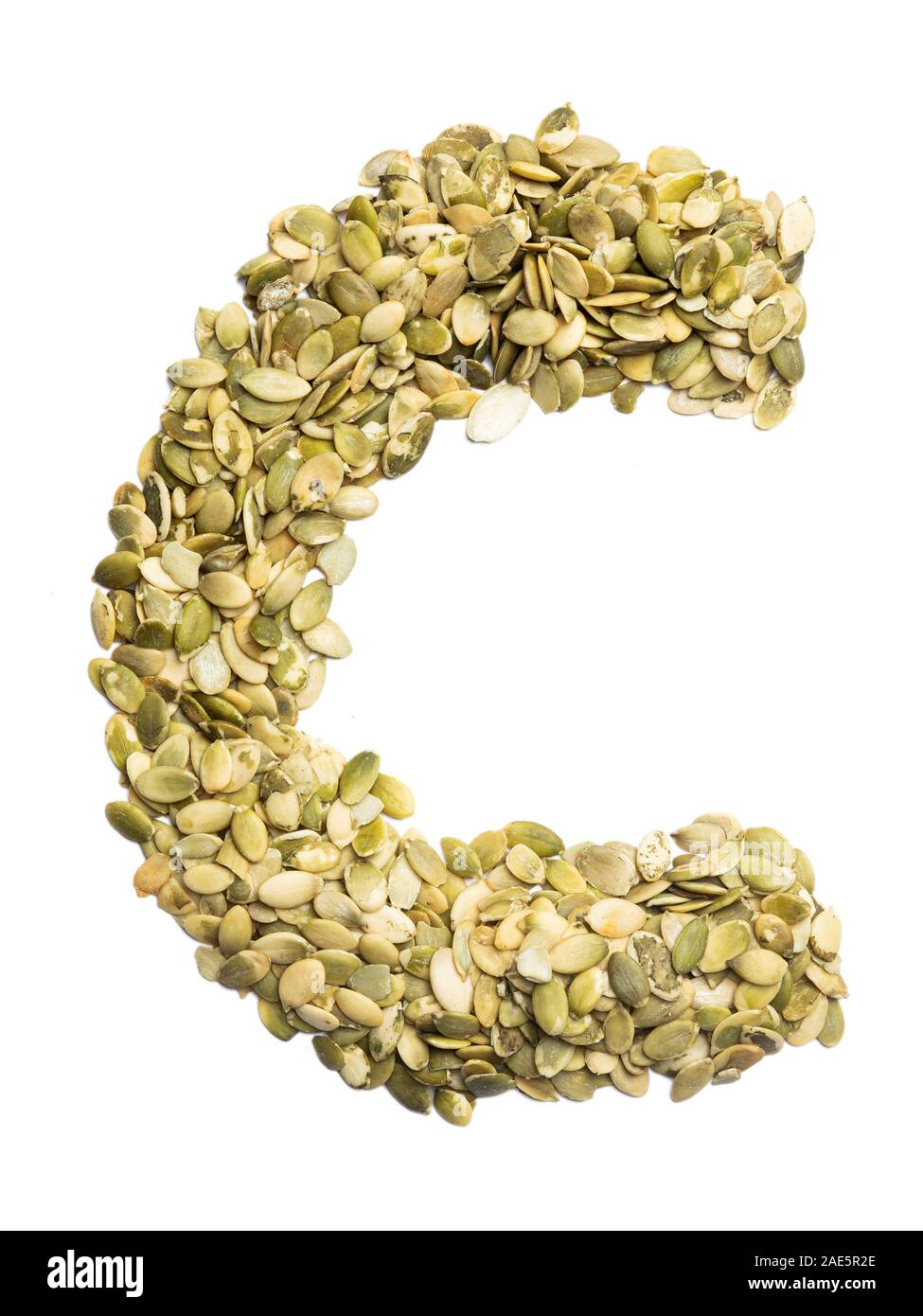 Letter C of the English alphabet from pumpkin seeds on a white isolated ...