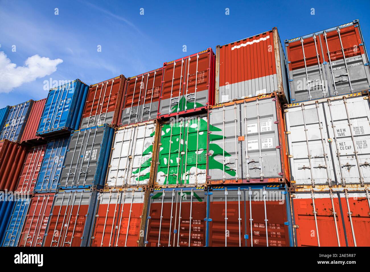 The national flag of Lebanon on a large number of metal containers for ...