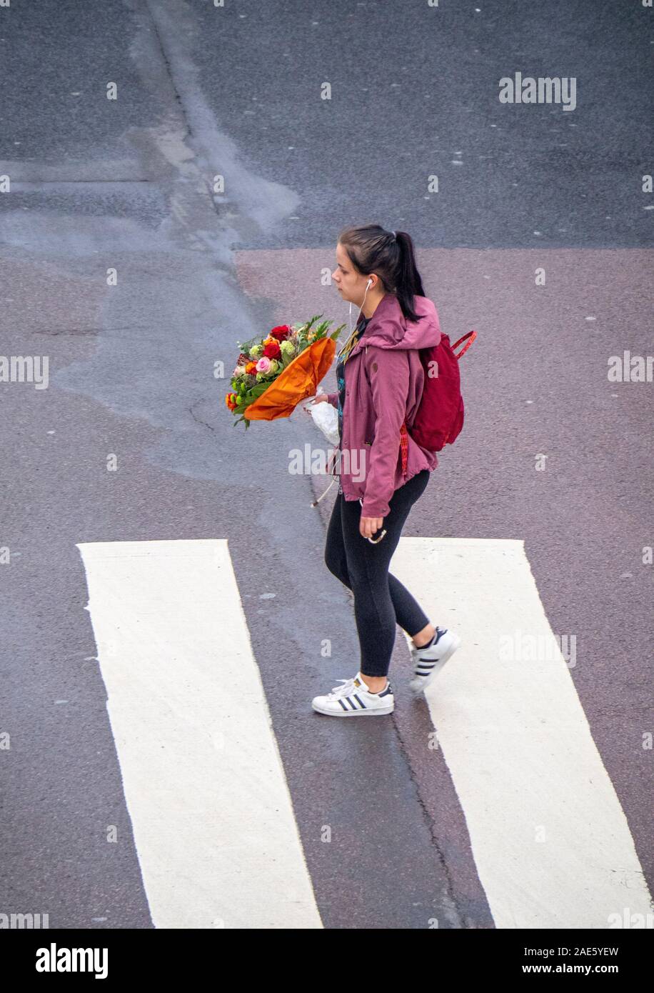 Woman carrying bouquet hi-res stock photography and images - Alamy