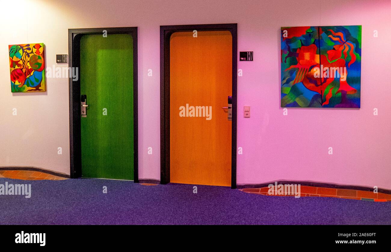 Coloured doors and corridor inside the artHOTEL in Hundertwasser Green ...