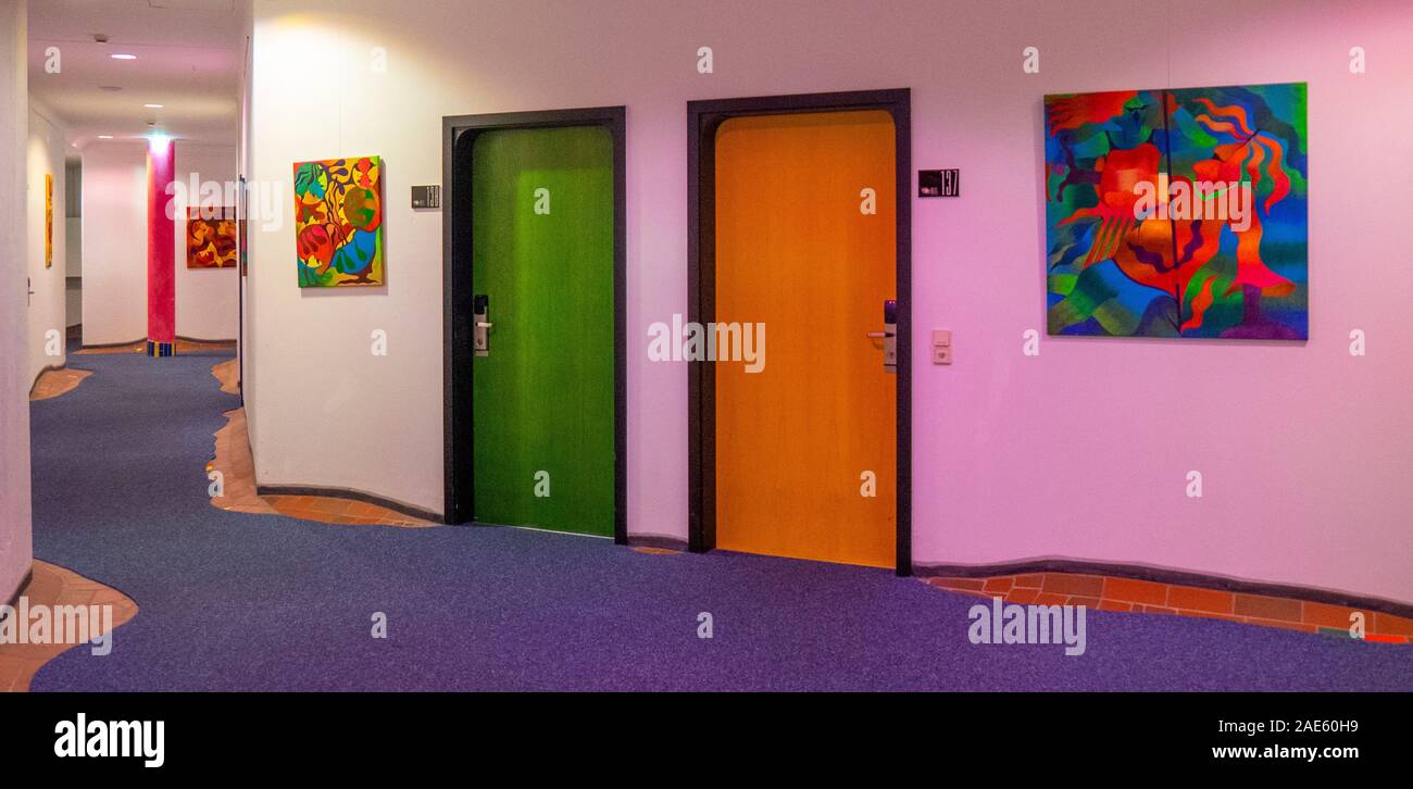 Coloured doors and corridor inside the artHOTEL in Hundertwasser Green ...