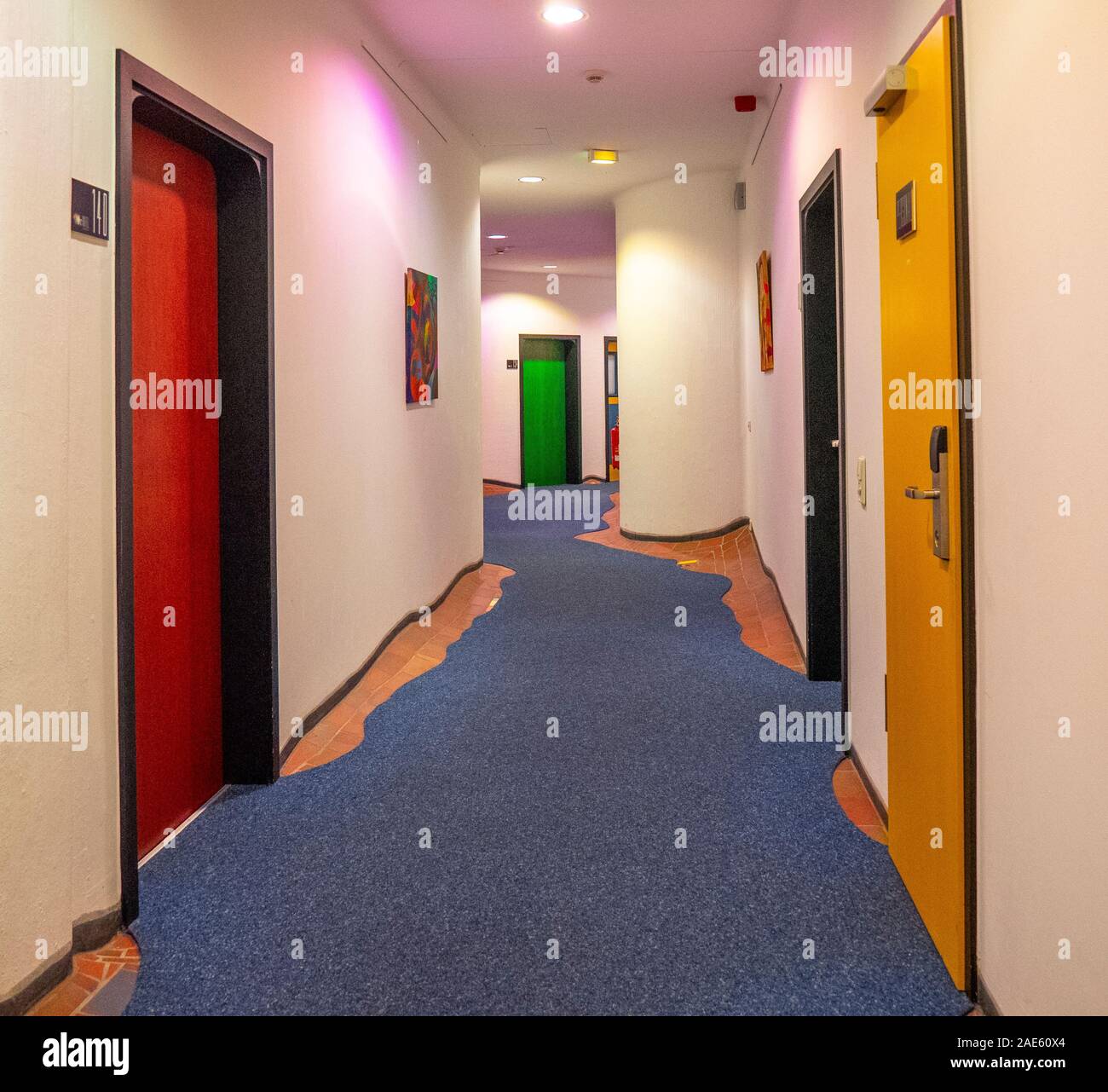Coloured doors and corridor inside the artHOTEL in Hundertwasser Green ...