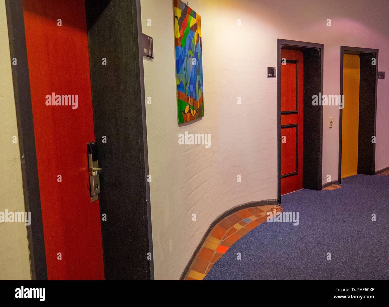 Coloured doors and corridor inside the artHOTEL in Hundertwasser Green ...
