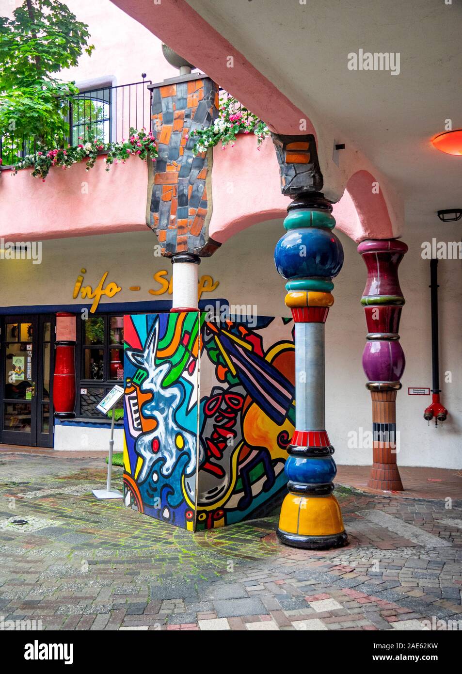 Colourful ceramic tiled columns in a courtyard of Hundertwasser Green ...