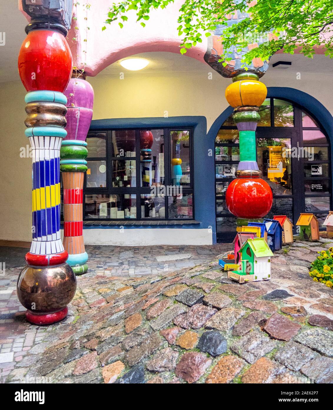 Colourful ceramic tiled columns in a courtyard of Hundertwasser Green ...