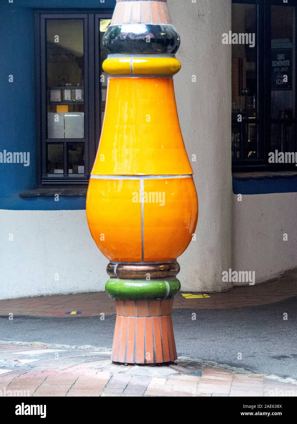 Colourful ceramic tiled column in a courtyard of Hundertwasser Green ...