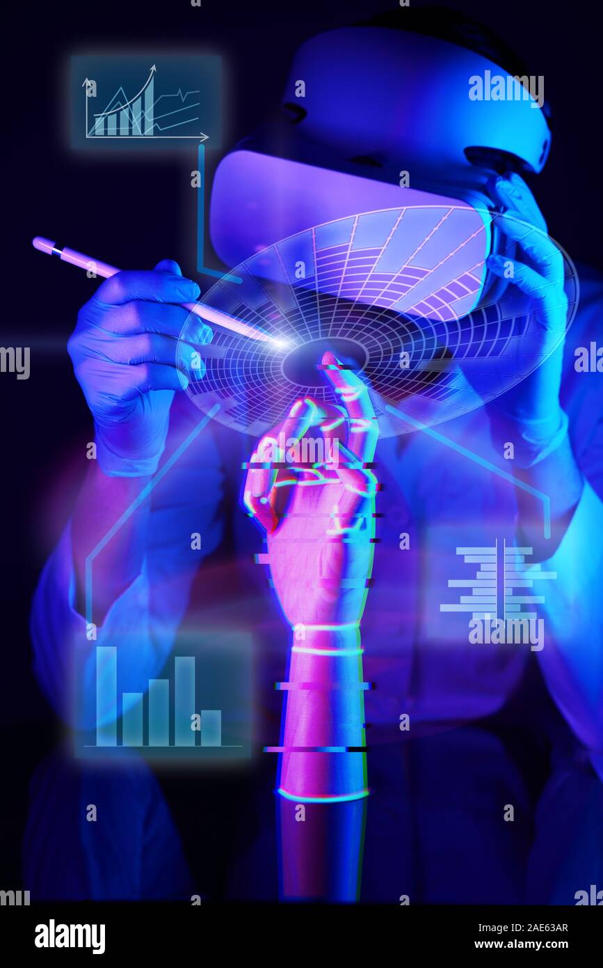 Engineer creates a robotic arm. Augmented Reality with graphics and ...