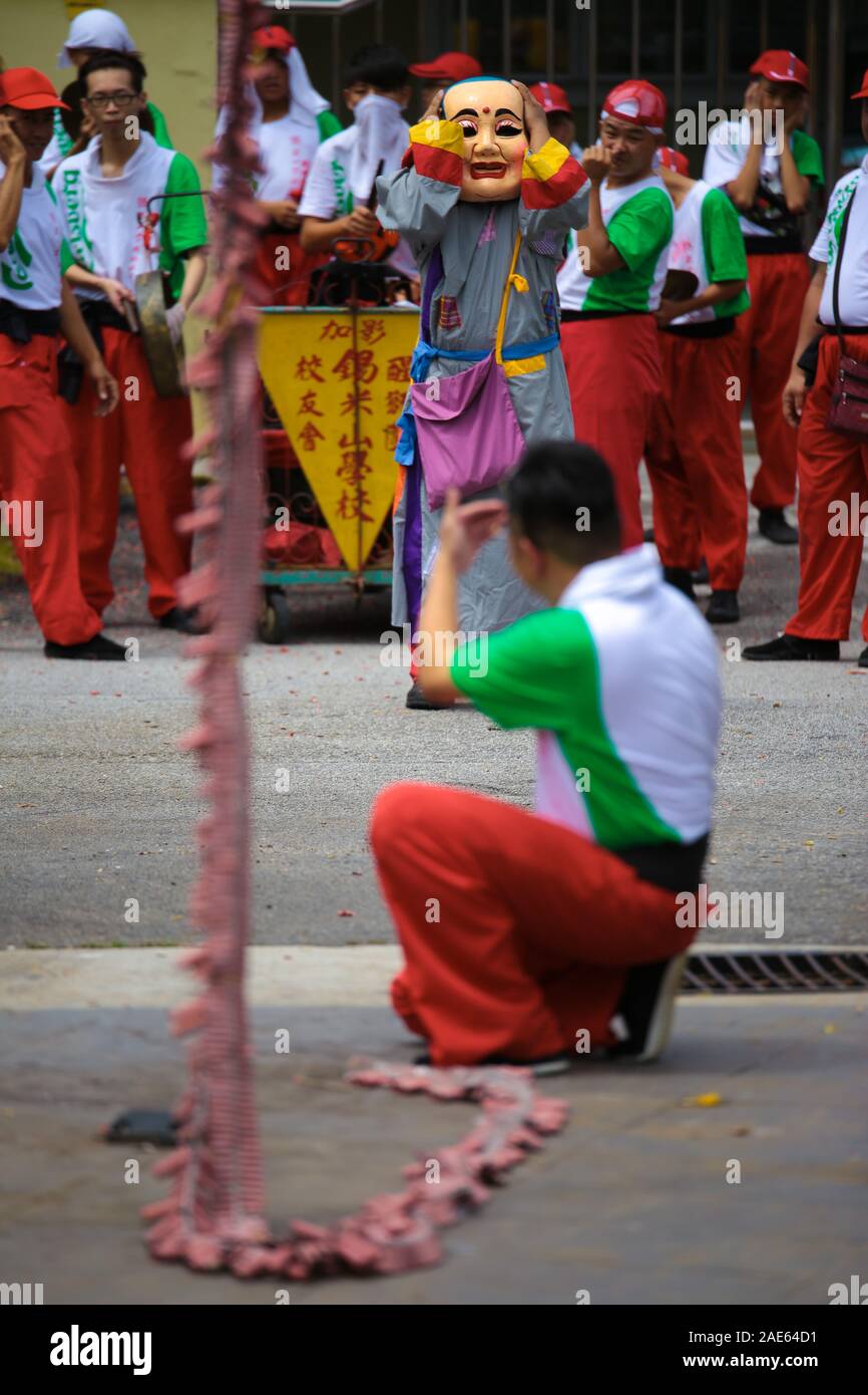 Lion dance ready to light up the chinese fire cracker during chinese ...