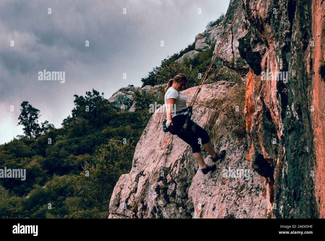 cave mountains climb escalade hiking man women Stock Photo - Alamy