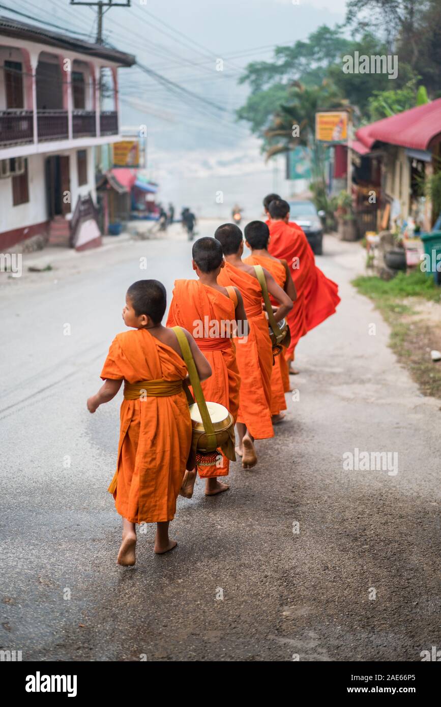 Monks procession in Pak Beng, Laos, Asia Stock Photo - Alamy