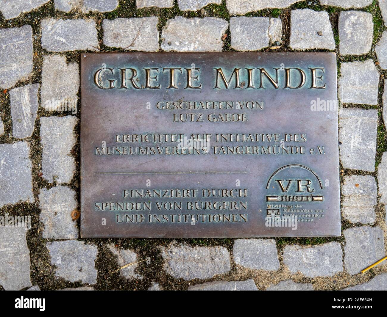 Bronze plaque at base of statue of Grete Minde by Lutz Gaede sculptor ...