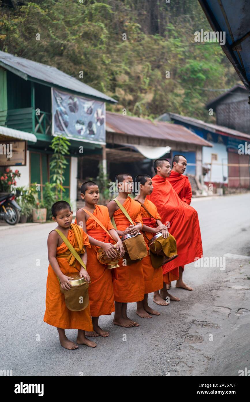 Monks procession in Pak Beng, Laos, Asia Stock Photo - Alamy