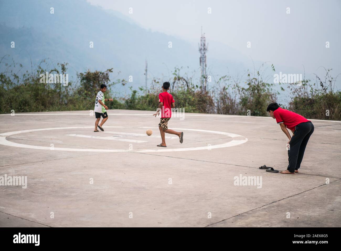 Boy play football, Pak Beng, Laos, asia Stock Photo - Alamy