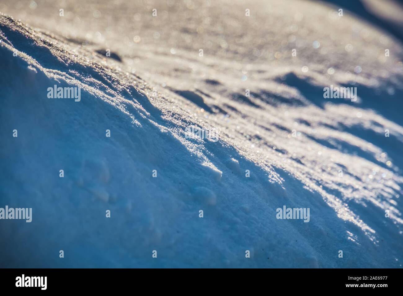 Deep blue shades on snow piles in winter morning Stock Photo - Alamy