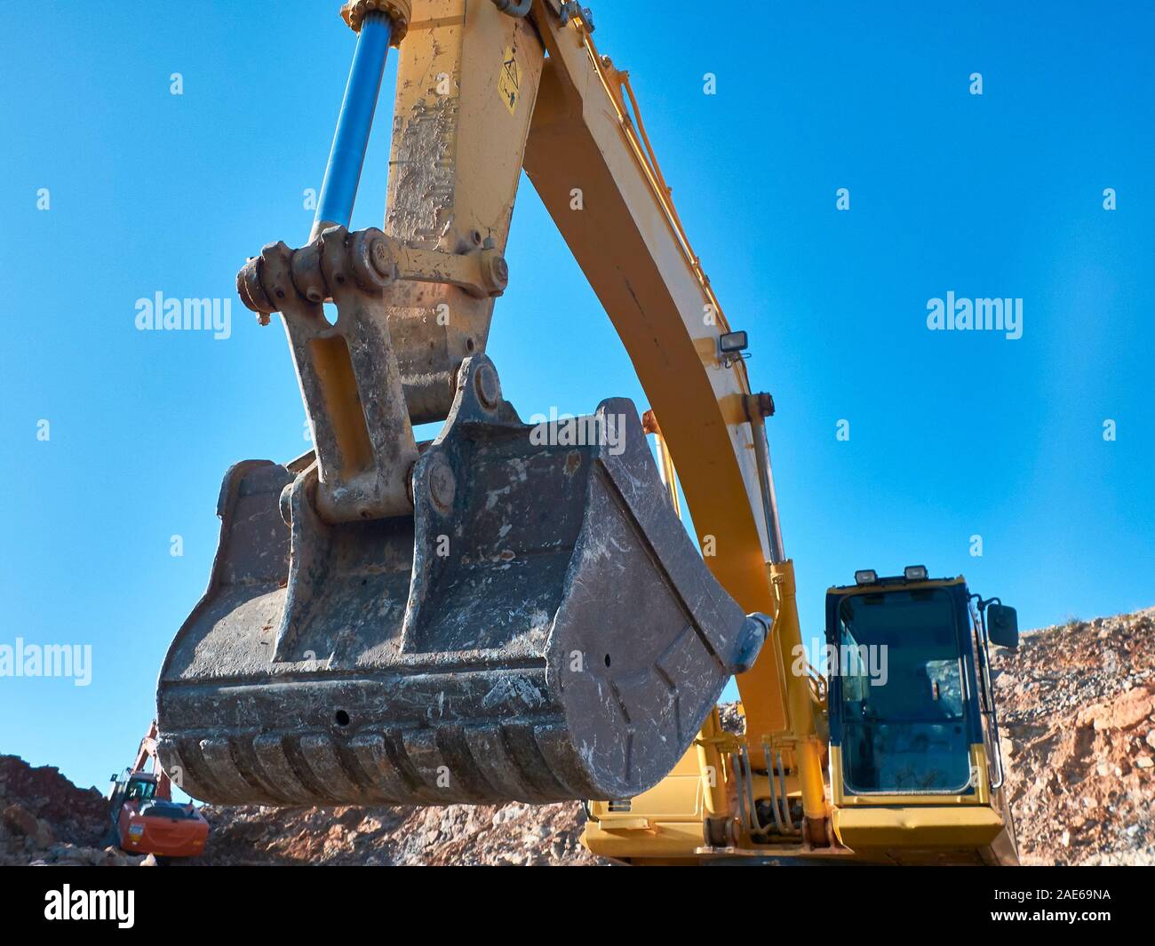 Excavator scoop during road construction on the rocky soils Stock Photo ...