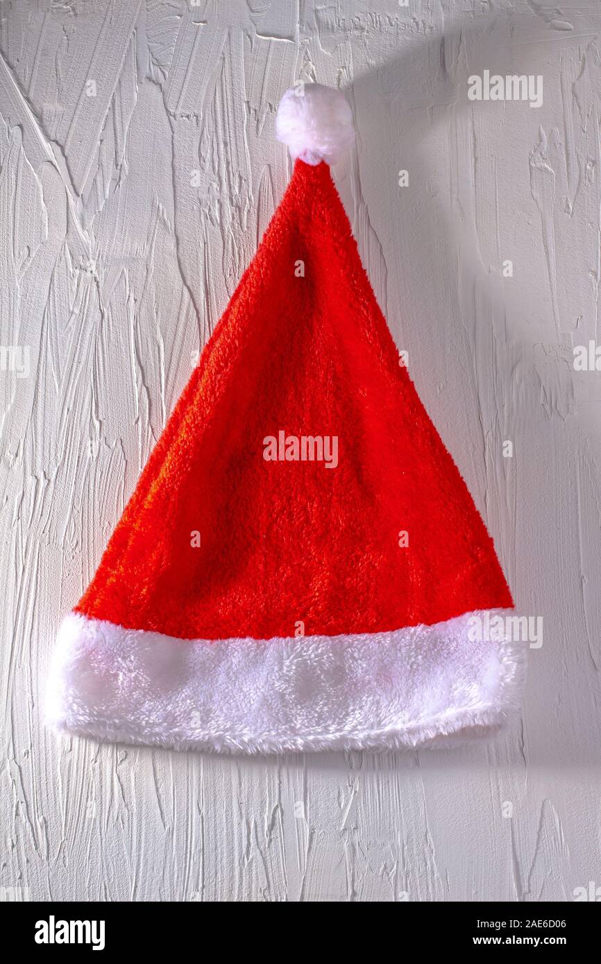 Santa Claus hat on white texture background with a shadow Stock Photo ...