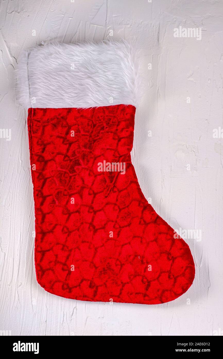 Christmas stocking on texture white background Stock Photo - Alamy