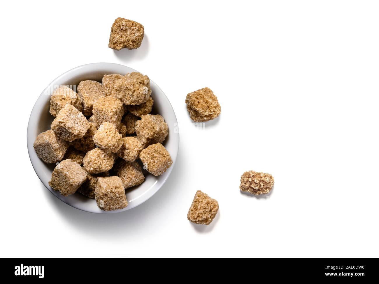 brown lump sugar on white background Stock Photo - Alamy